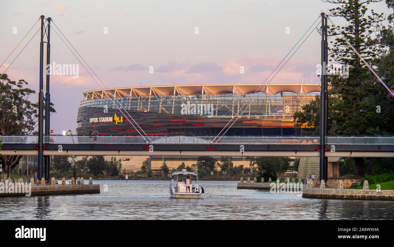 A boat passing under footbridge Trafalgar Bridge from Claisebrook Cove ...