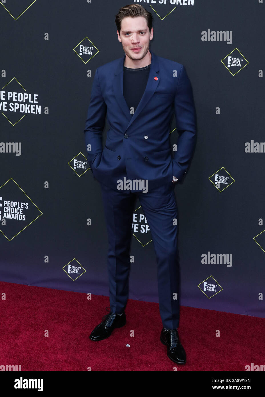 Dominic Sherwood arrives at the 2019 E! People's Choice Awards held at ...