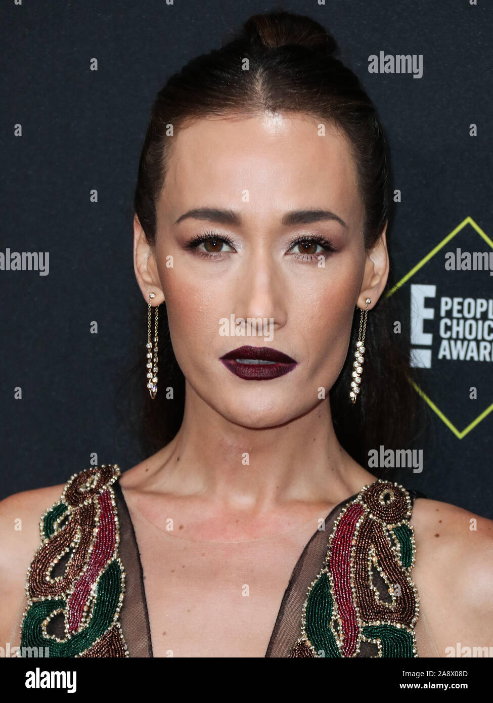 Actress Maggie Q wearing Sebastian Gunawan arrives at the 2019 E ...