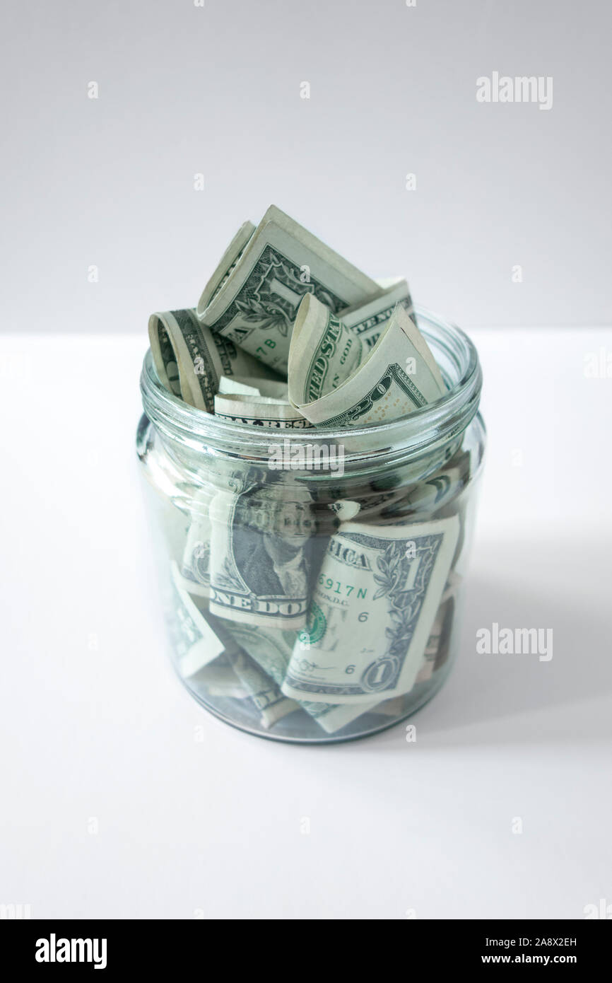 Dollar savings money jar banknote hi-res stock photography and images ...