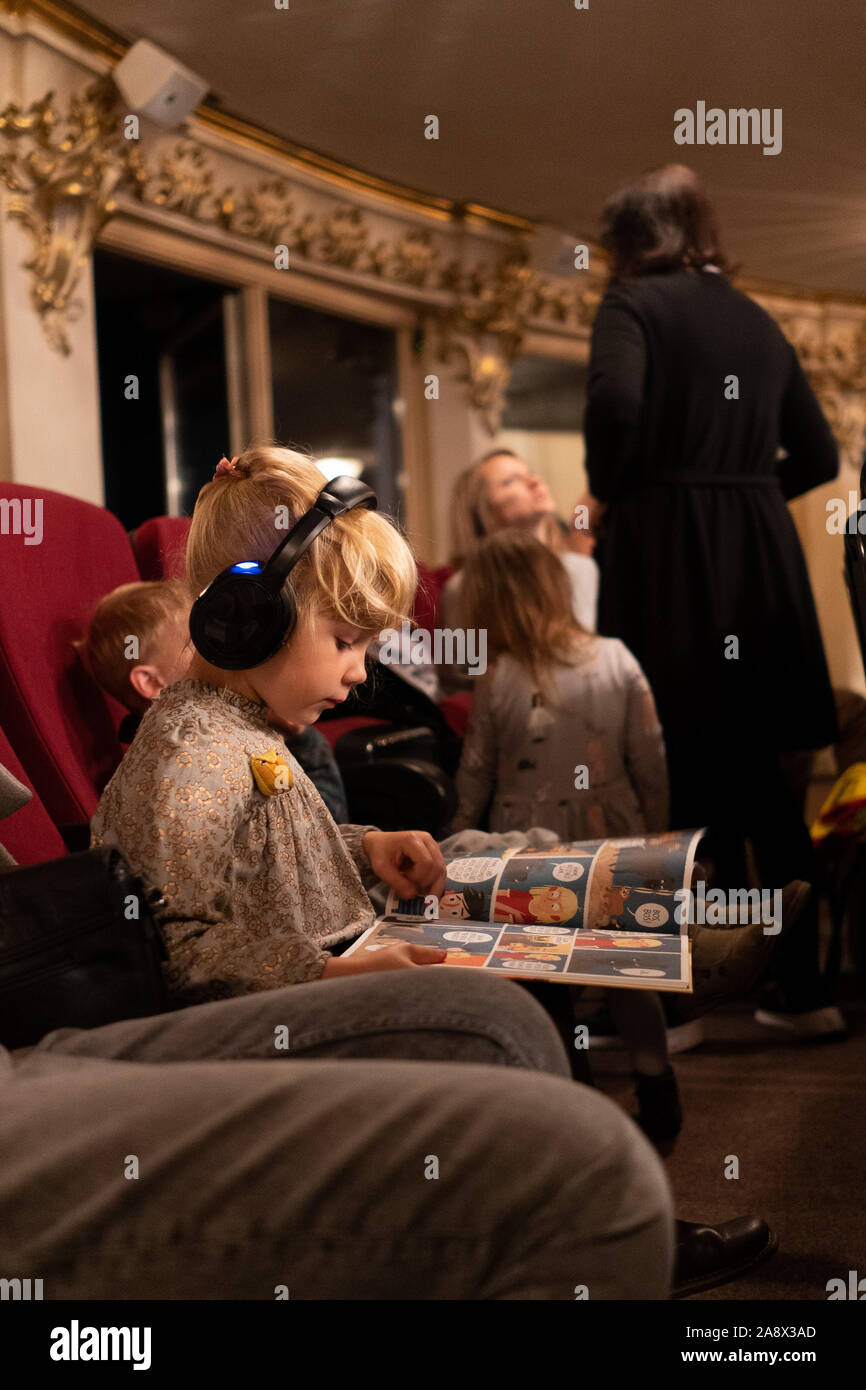 Child headphones child reading book hi-res stock photography and images ...