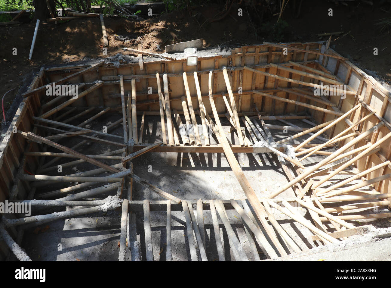 The ground recessed pool in the process of construction. Masonry ...