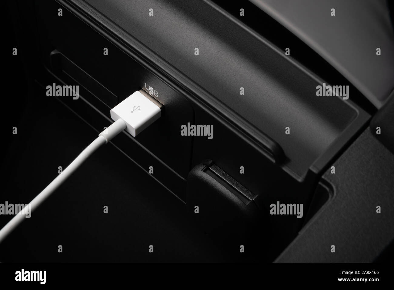 USB cable plugged into modern car interior Stock Photo - Alamy