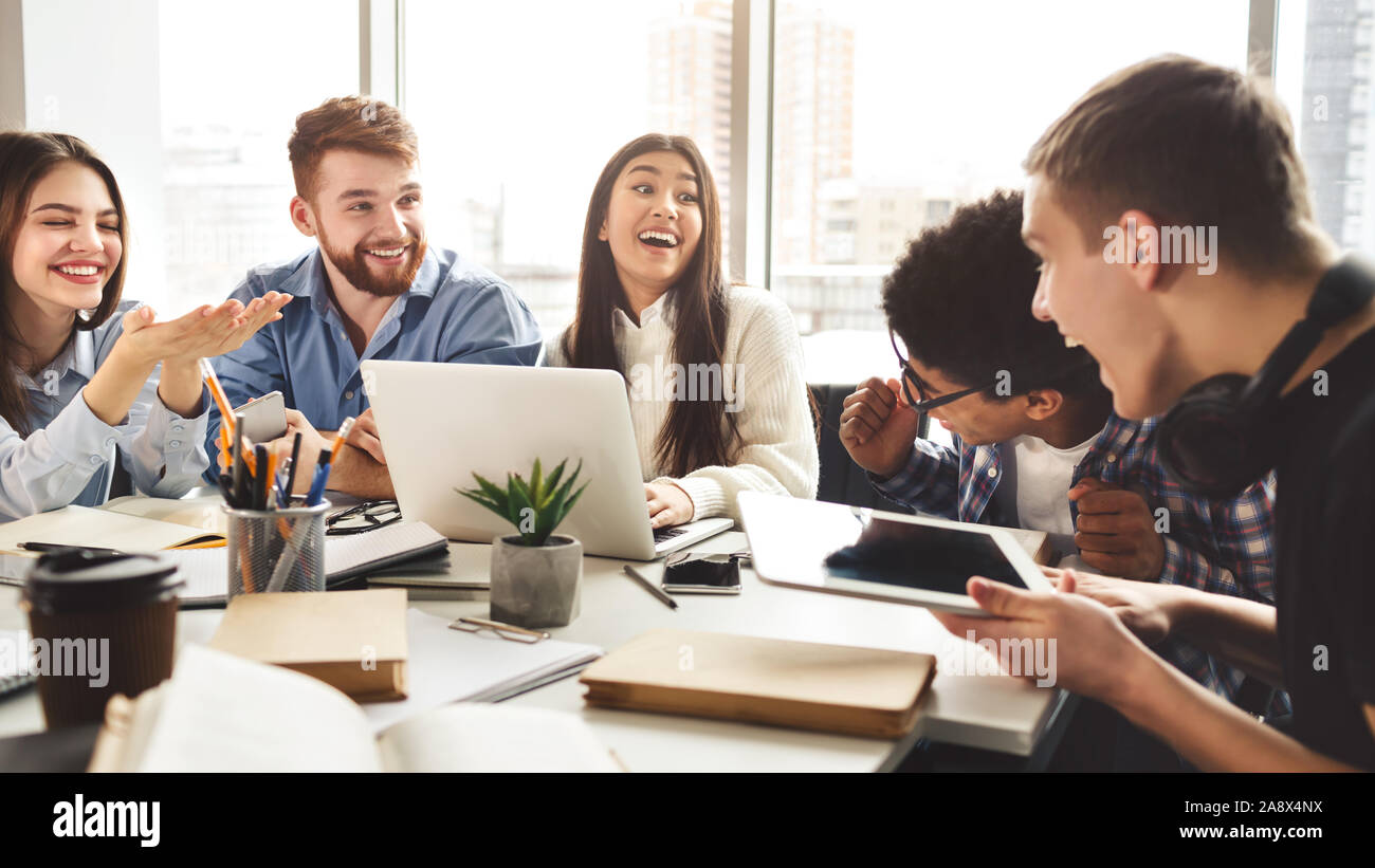 University friends enjoying group study in library Stock Photo - Alamy