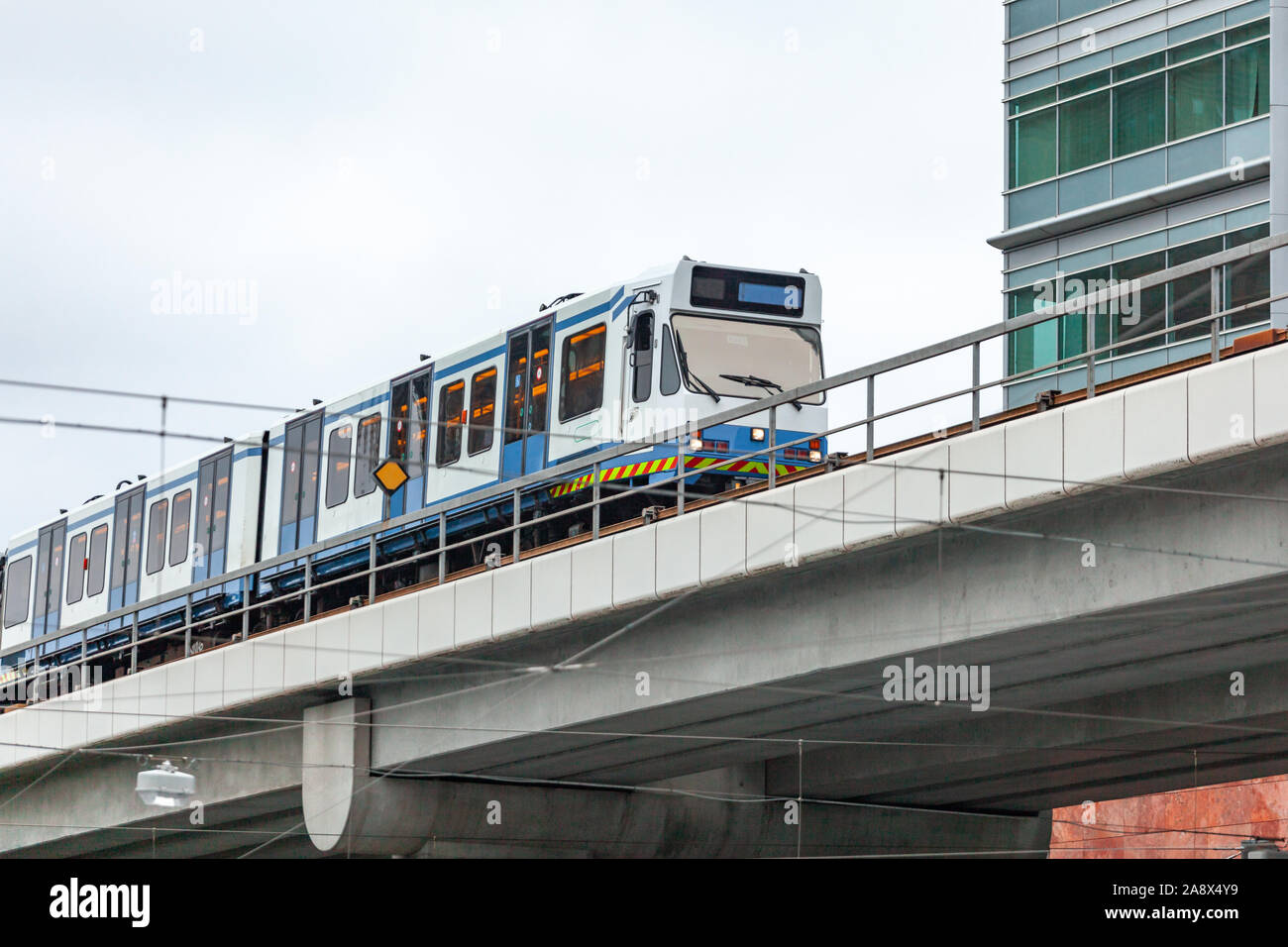 Skytrain in city Amsterdam. Passenger train in Netherlands ...