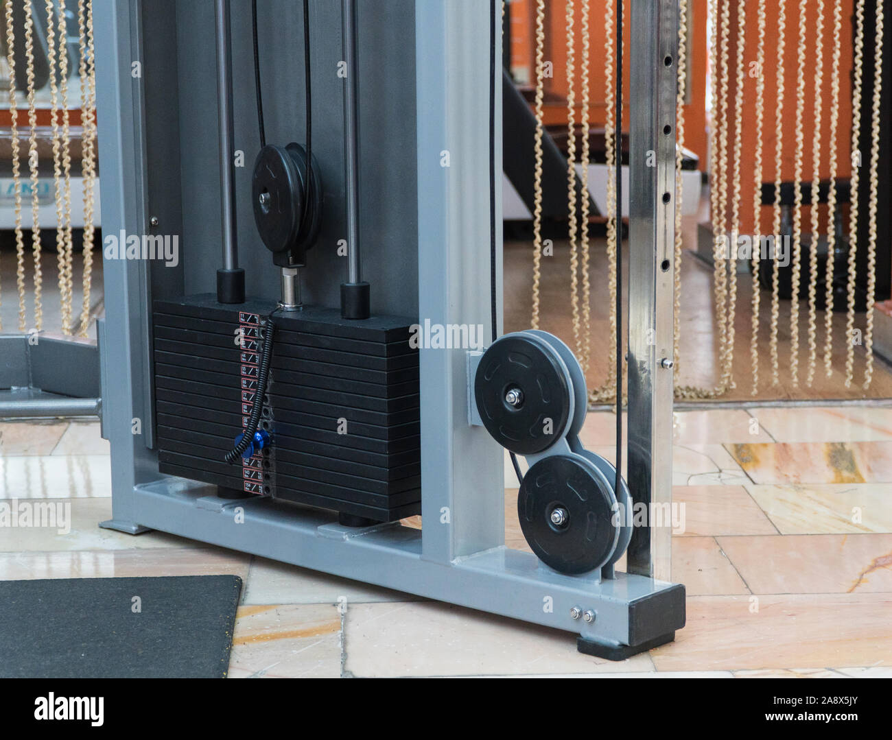 stack weights in gym bodybuilding equipment Stock Photo - Alamy