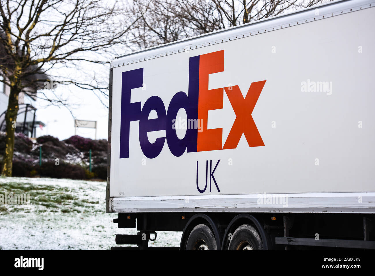 Fed Ex lorries ready having maintenance and being loaded with parcels ...