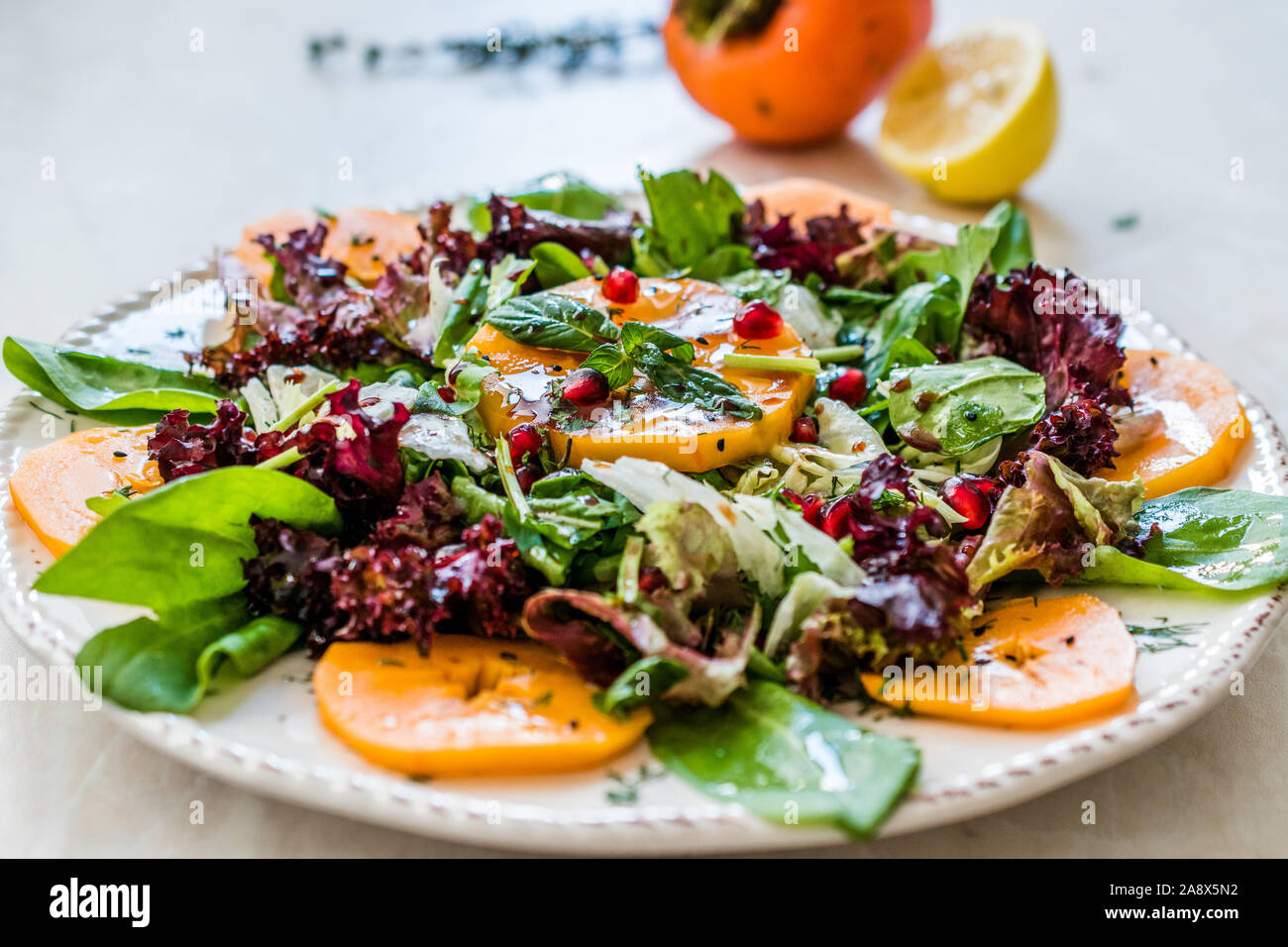 Persimmon Fruit Salad with Pomegranate, Lollo Rosso Lettuce, Rocket ...