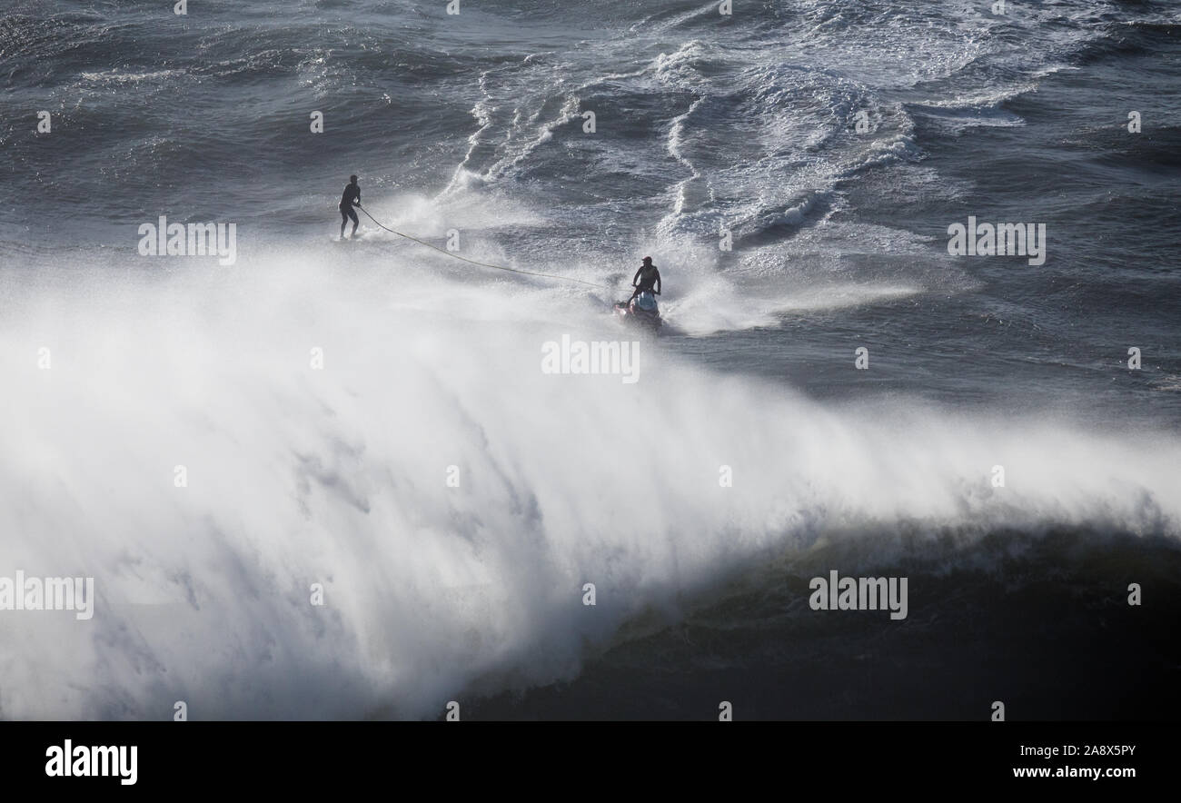 Surfing Big Waves in North Beach, Nazare, Portugal Stock Photo - Alamy