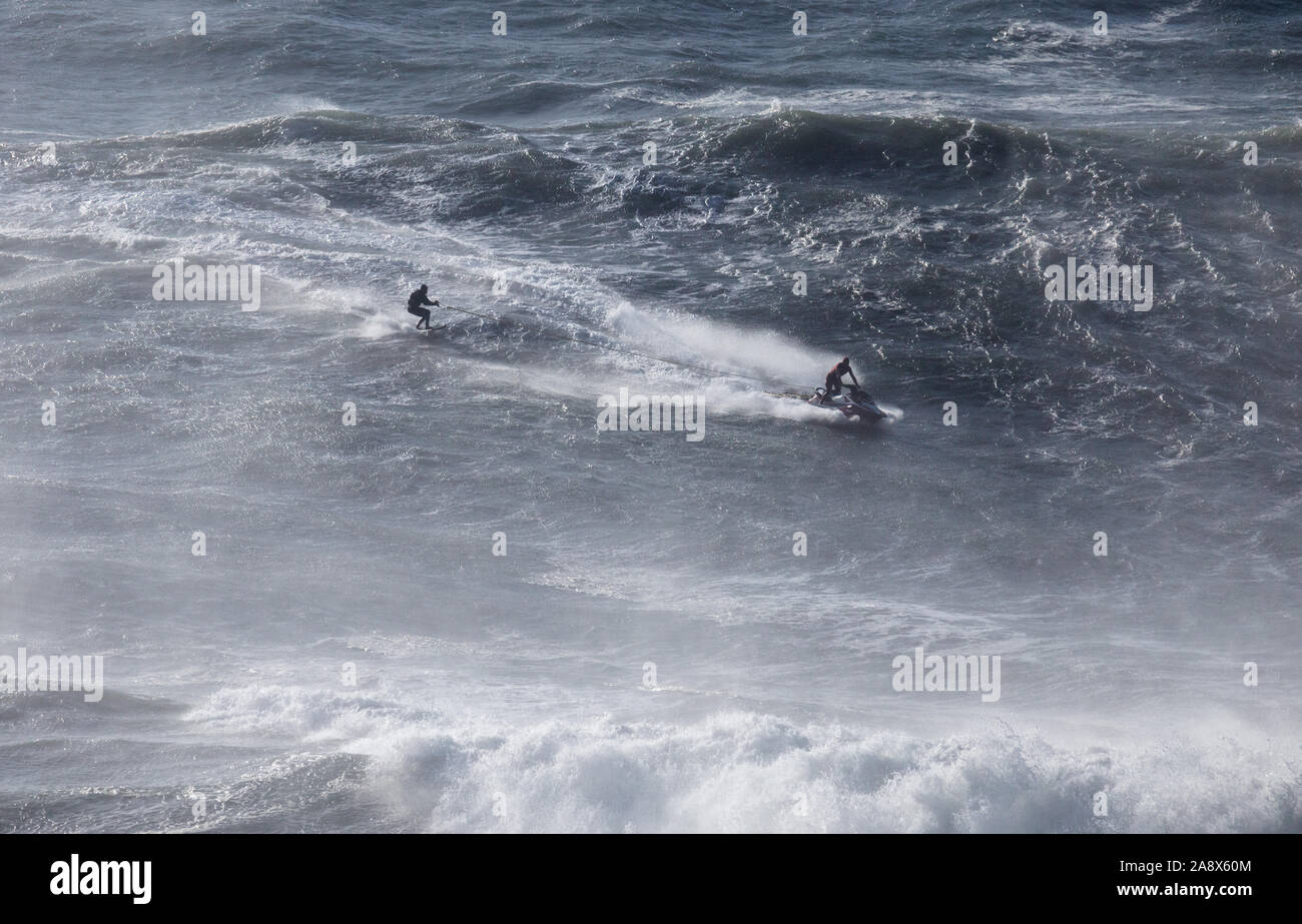 Surfing Big Waves in North Beach, Nazare, Portugal Stock Photo - Alamy