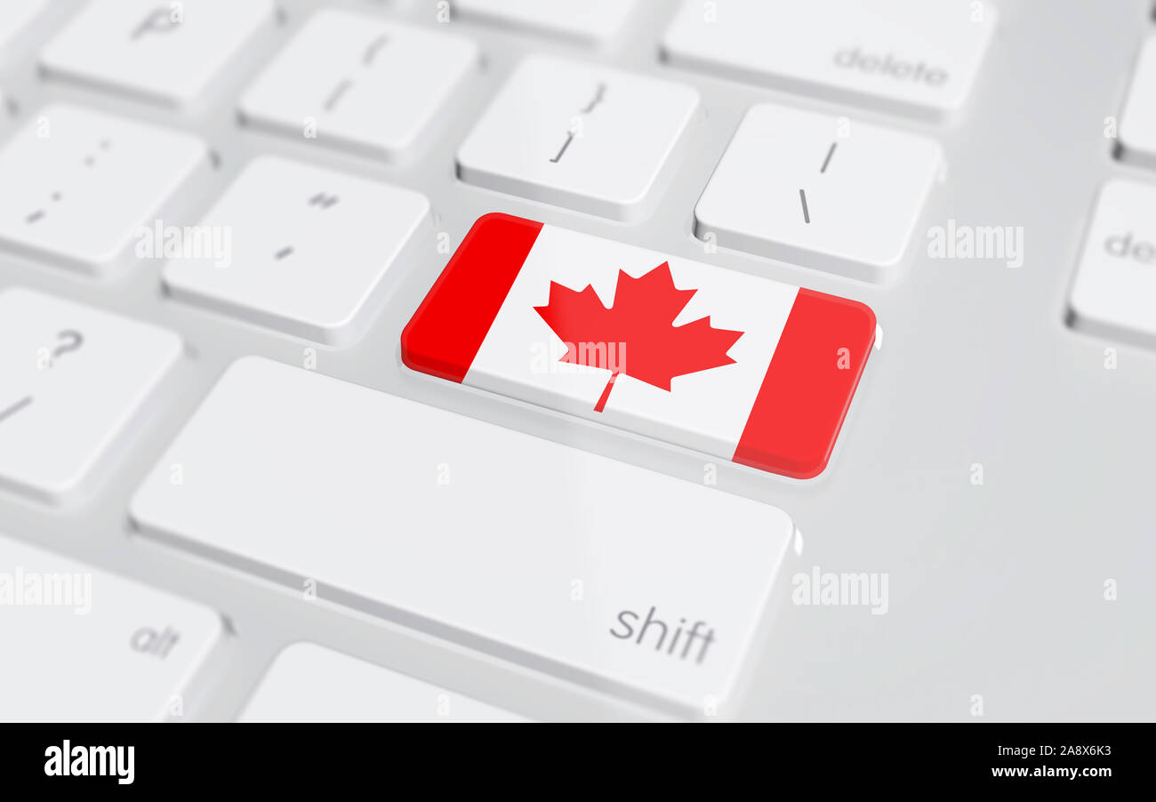 Laptop or desktop computer keyboard focus on one key with Canadian flag ...