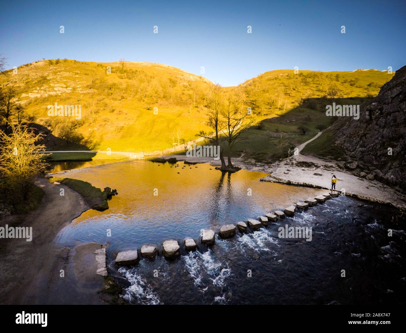 Aerial views of the stunning Dovedale stepping stones and mountains in ...