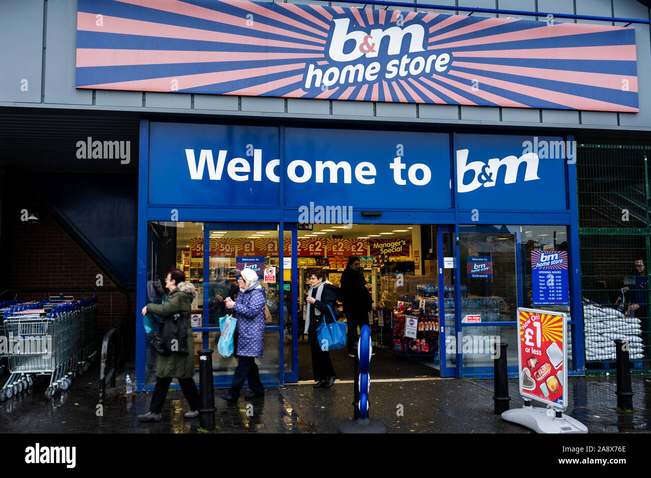 Customer walk in and out of the B&M store in Longton, Stoke on Trent ...