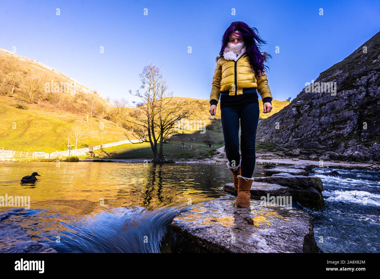 Girl walking over rocks hi-res stock photography and images - Alamy