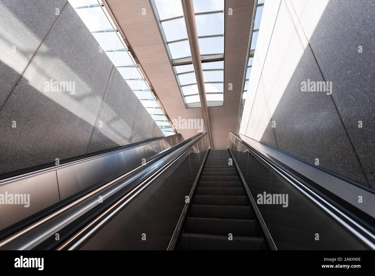 The escalator rises up the street Stock Photo - Alamy