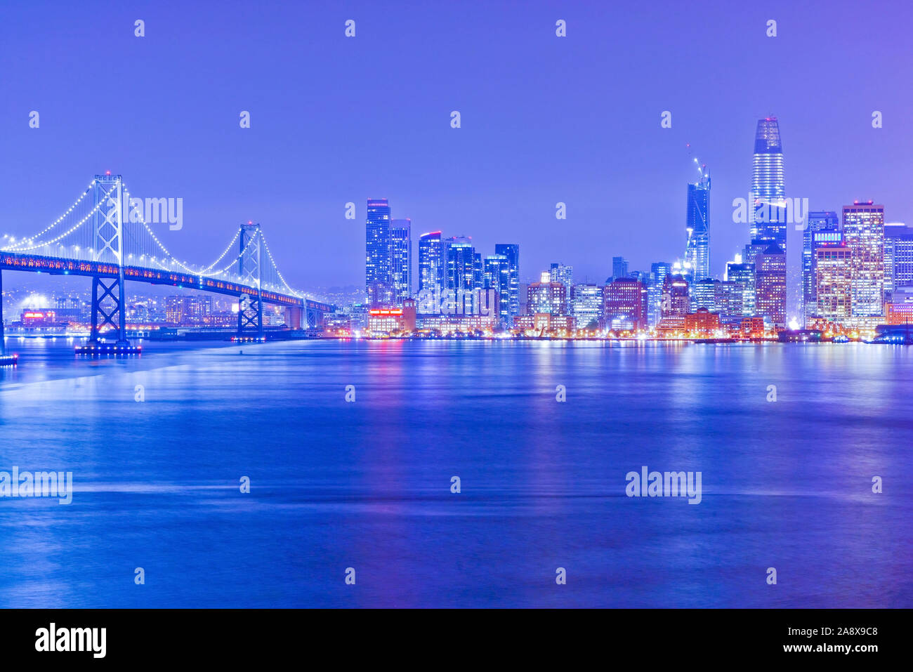 View of Bay Bridge across San Francisco Bay in San Francisco at night ...