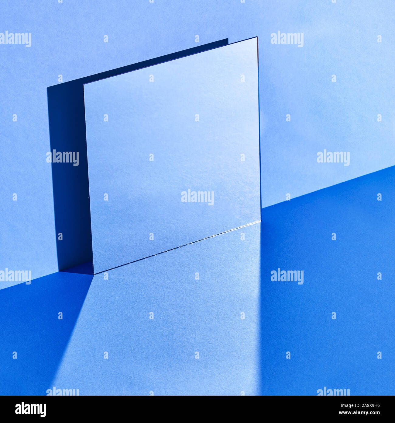 Still life space with a mirror and hard light Stock Photo - Alamy