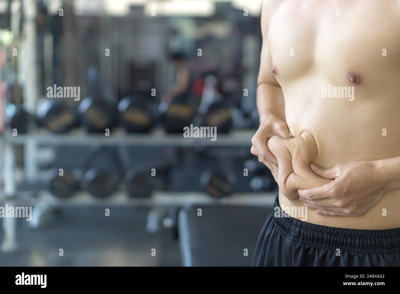 Holding stomach fat hi-res stock photography and images - Alamy