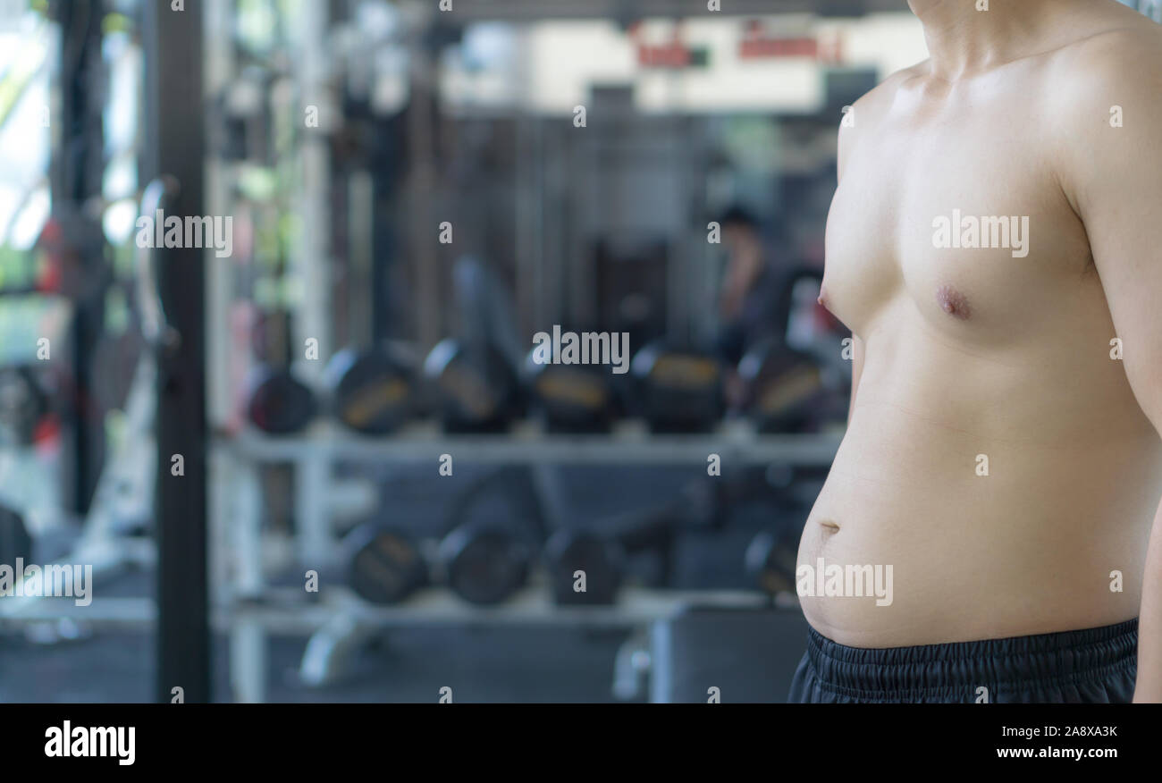 Close up the excessive fat belly. Man overweight abdomen. Man diet ...