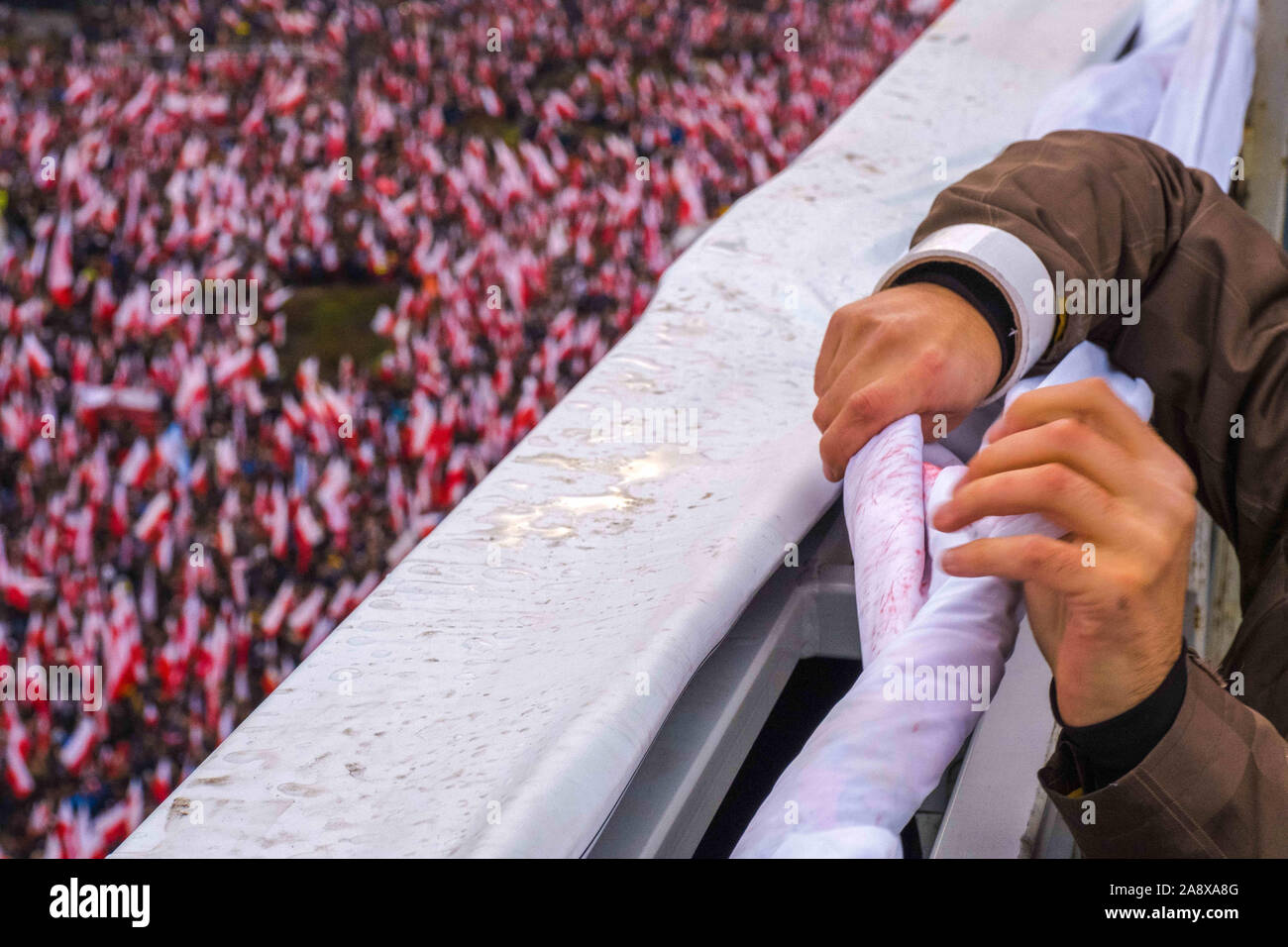 November 11, 2019: Anti-nationalist activists are hanging Polish flag ...
