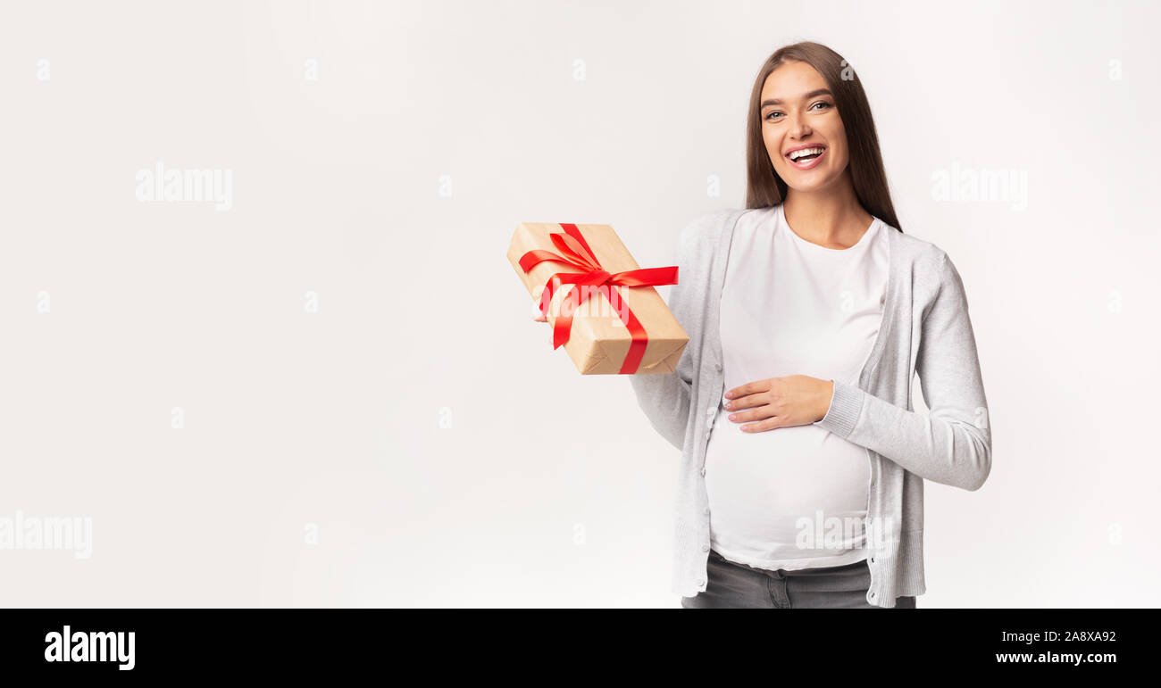 Pregnant Woman Holding Wrapped Box Standing Over White Background ...