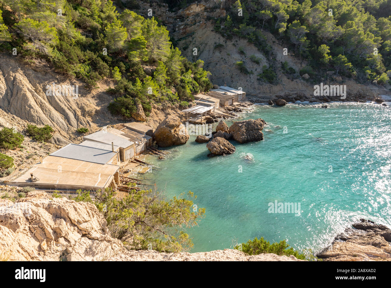 Turquoise waters in Es Portitxol, Ibiza, Spain. Hidden bay on the ...