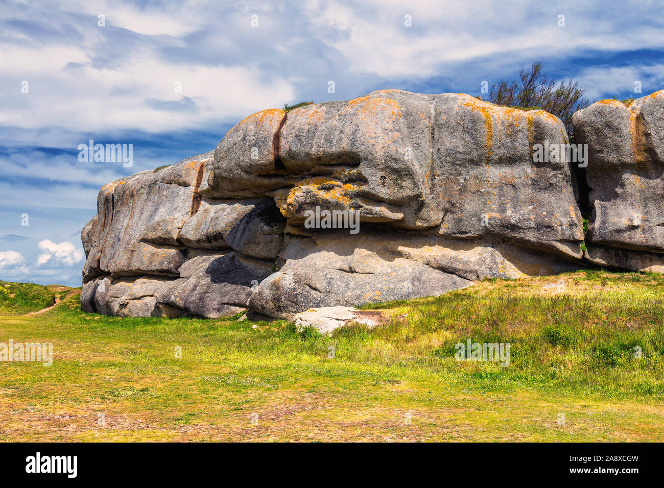 The pink granite rocks with strange shapes, coast in Brittany. The mass ...
