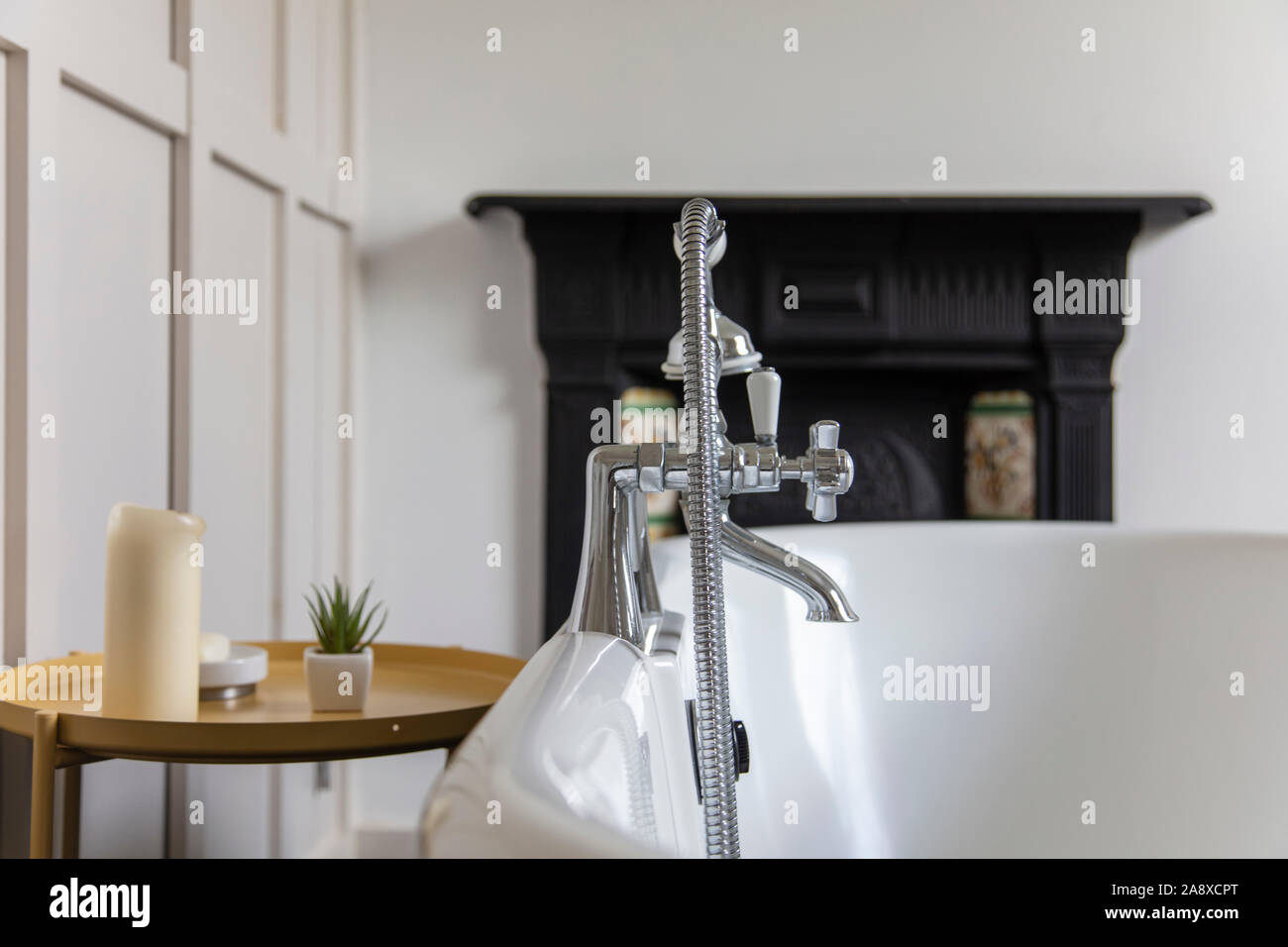 Luxury bathroom interior with classic rolltop bath tub and vintage tap ...