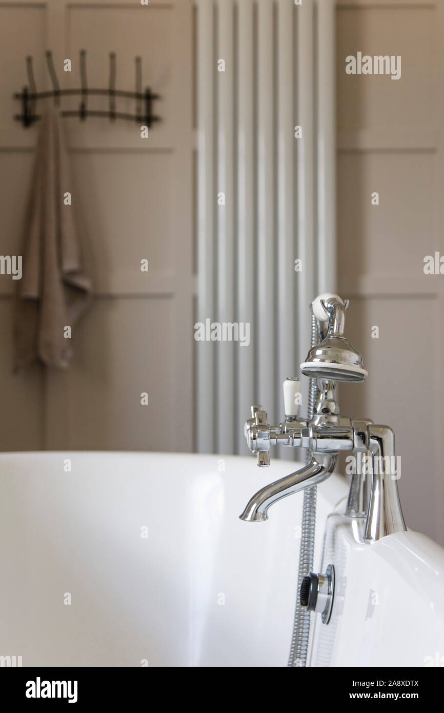 Luxury bathroom interior with classic rolltop bath tub and vintage tap ...