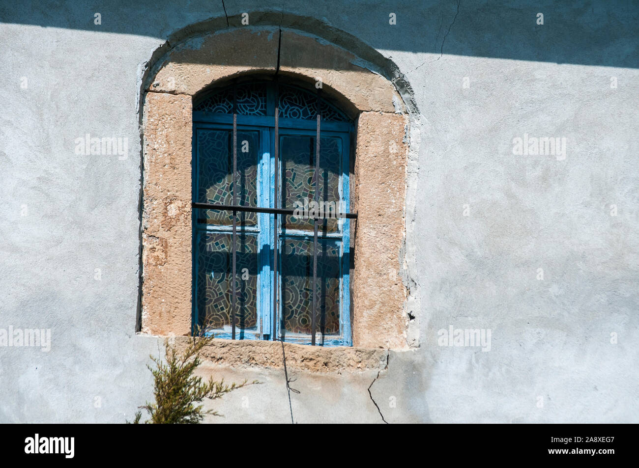 Blue wooden framed window of old vintage retro village house closeup in ...