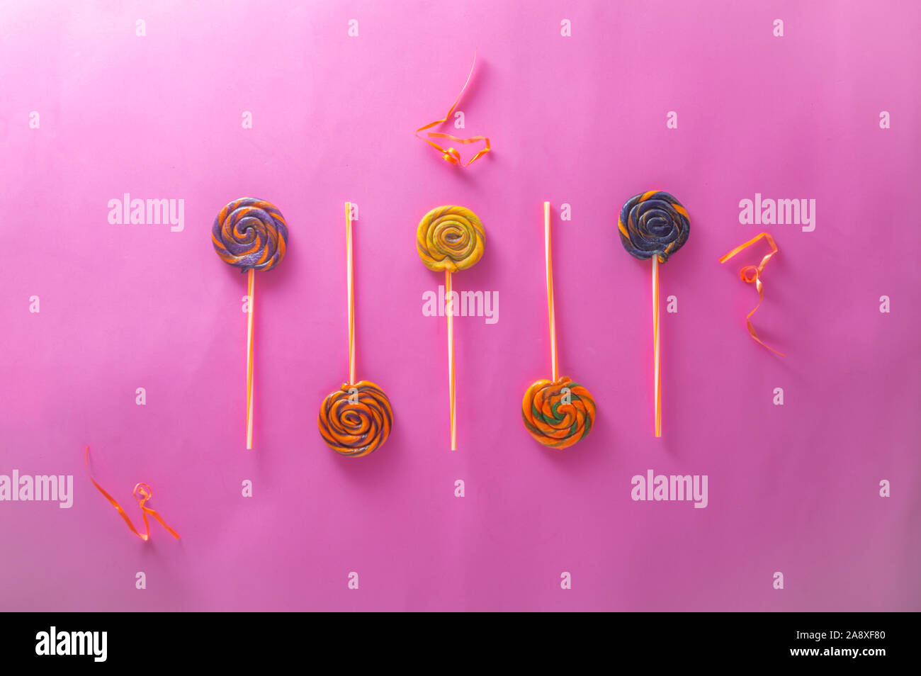 Candy lollipops, sweet lollies isolated on pink background, with ...