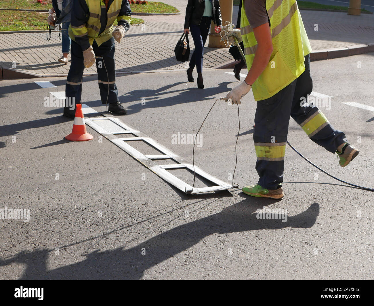 Road marking. Drawing a road marking. spraying in road construction ...