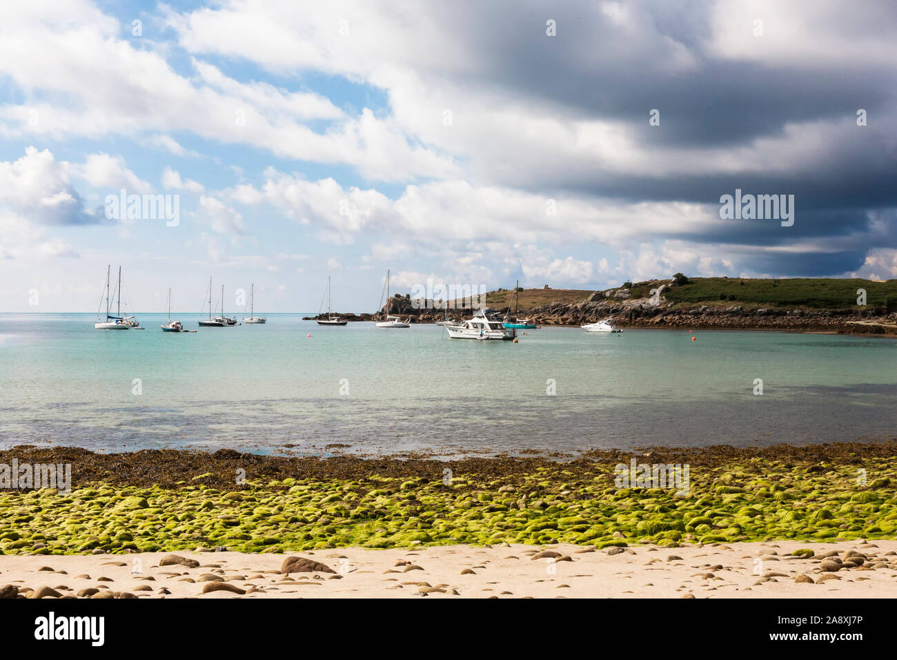 Yachts at anchor in The Cove, a bay between St. Agnes and Gugh, Isles ...