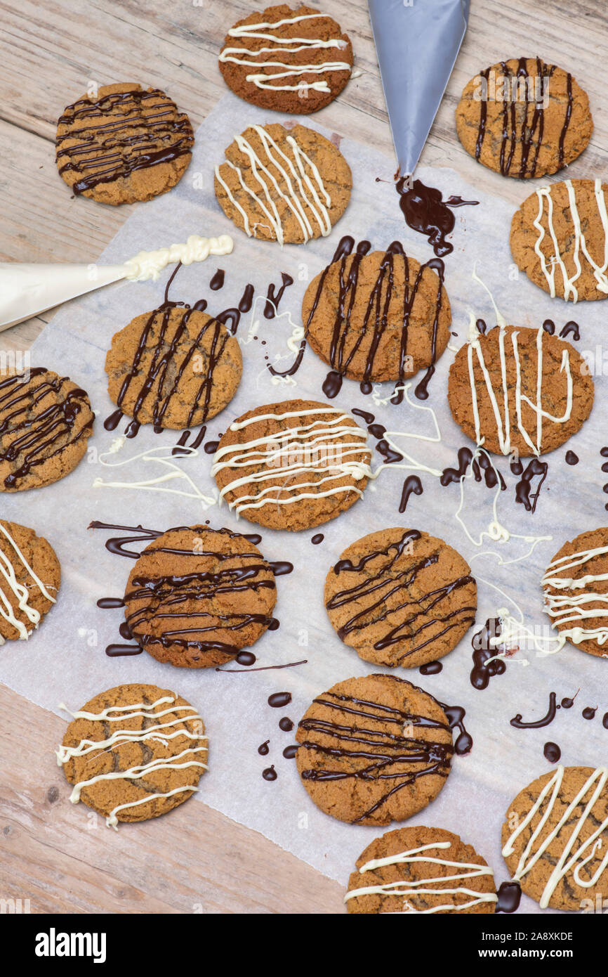 Homemade Ginger Biscuits With Chocolate Drizzle Stock Photo Alamy homemade-ginger-biscuits-with-chocolate-drizzle-stock-photo-alamy