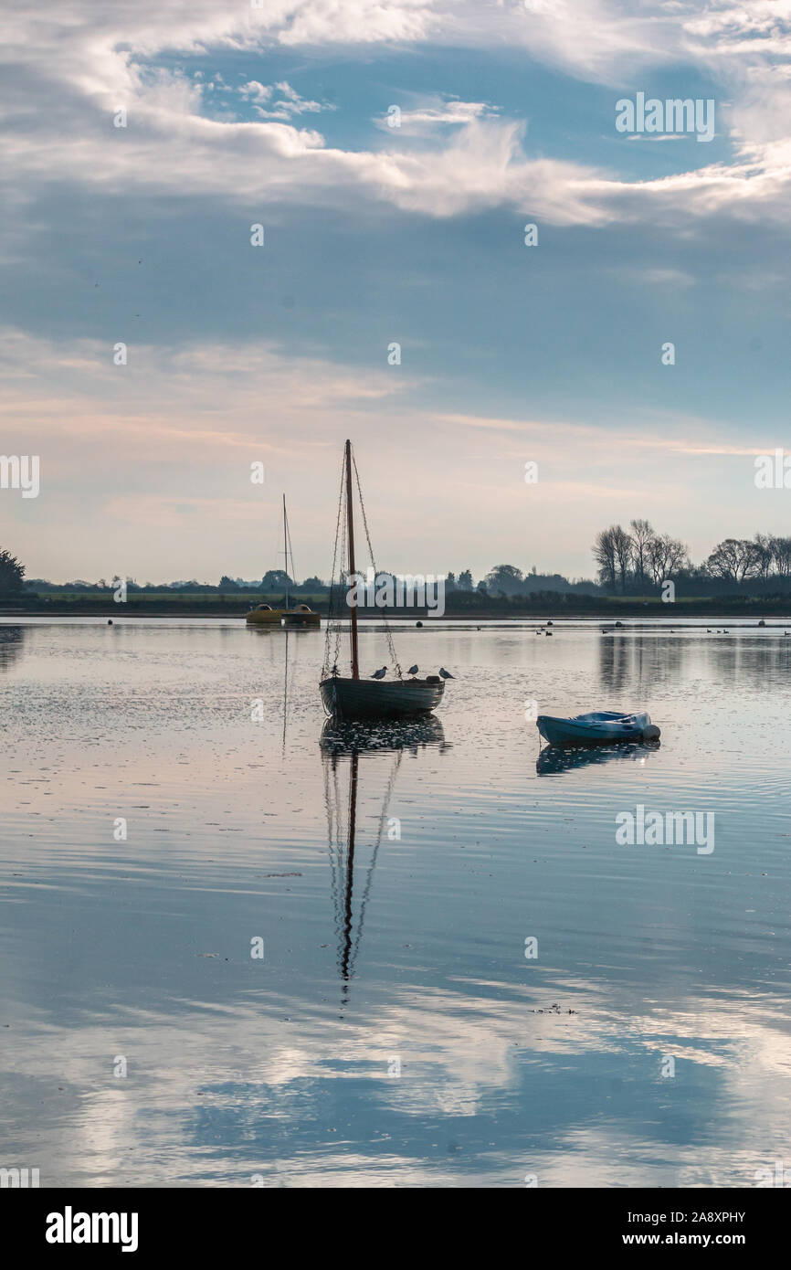 Evening Calm boat reflections Stock Photo - Alamy