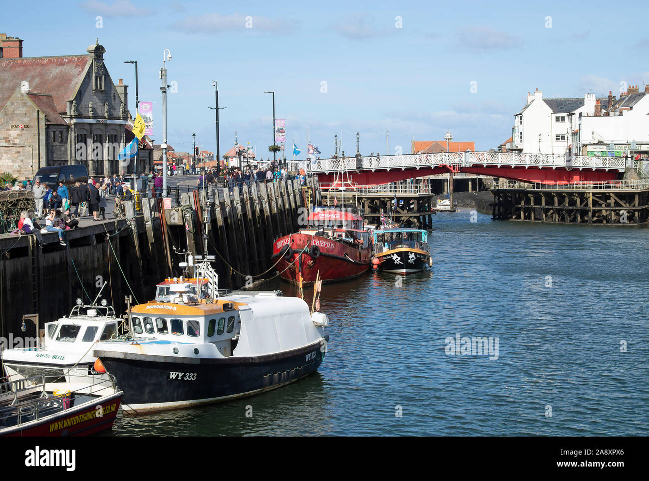 The Red Road and Pedestrian Swing Bridge with Fishing Boats on the ...