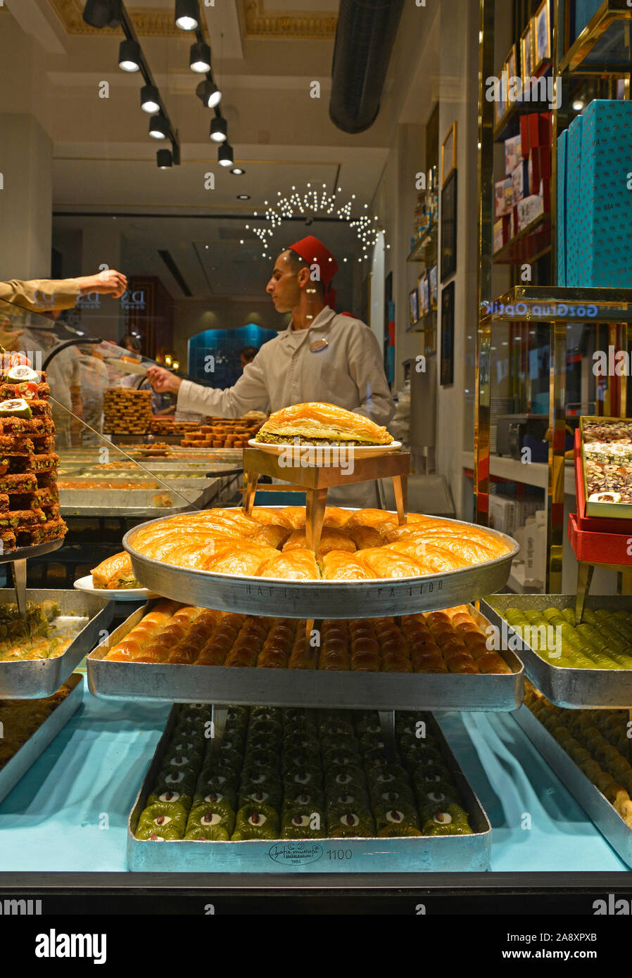 Istanbul, Turkey - September 7th 2019. Shop workers serve customers ...