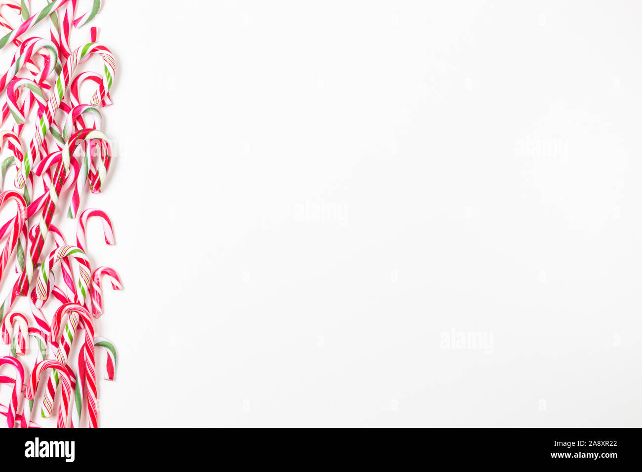 Candy canes border frame on white background. Top view, copy space ...