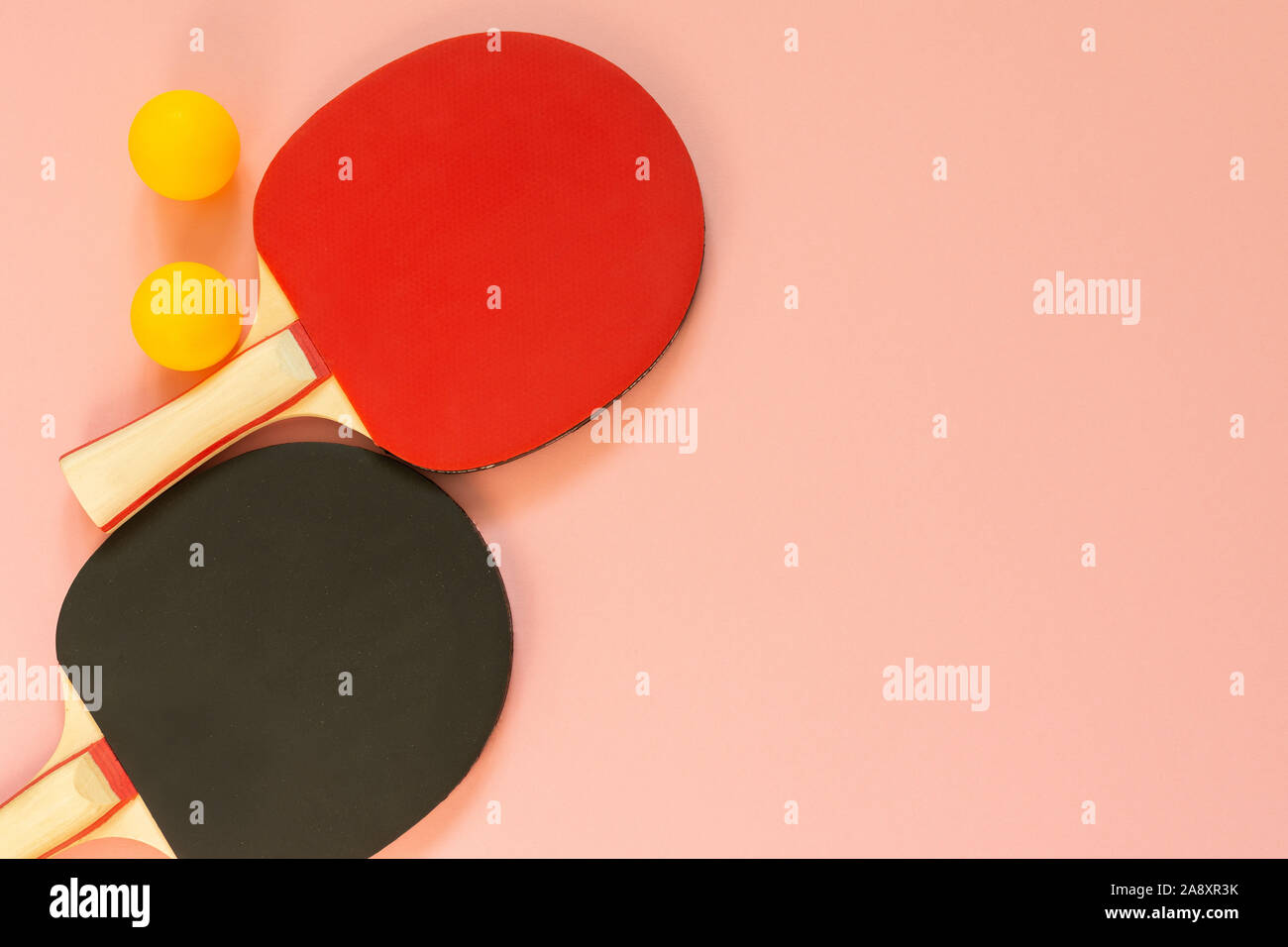 Black and red tennis ping pong rackets and orange balls isolated on a ...