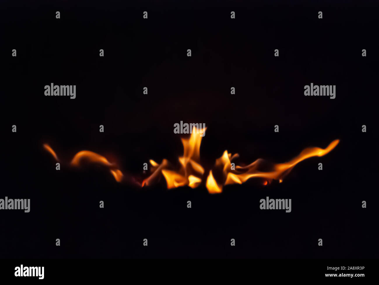Fire Spreading Out against a black background Stock Photo - Alamy
