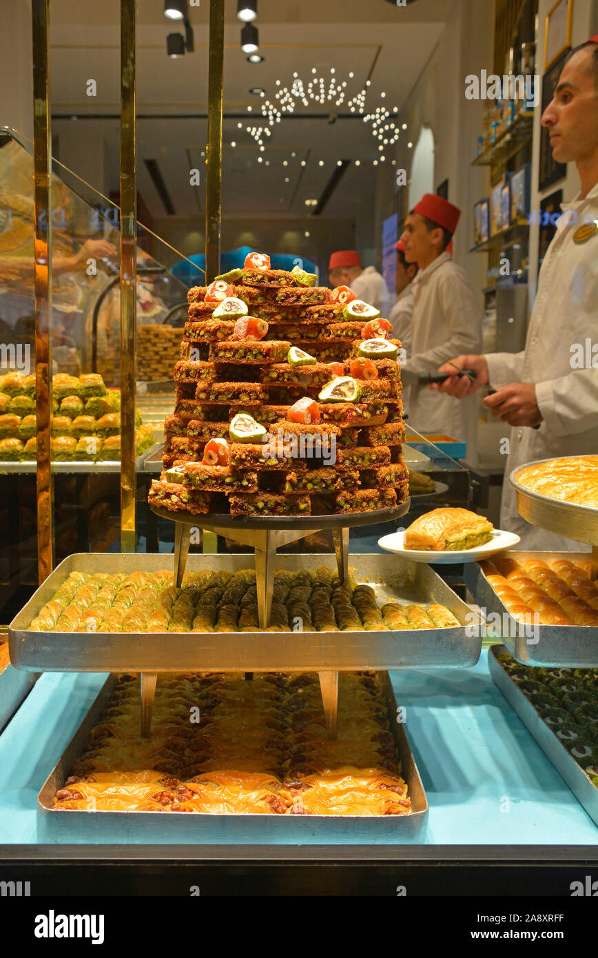 Istanbul, Turkey - September 7th 2019. Shop workers serve customers ...