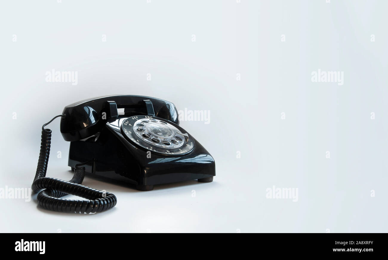 A Vintage Rotary Phone Against a White Background Stock Photo - Alamy