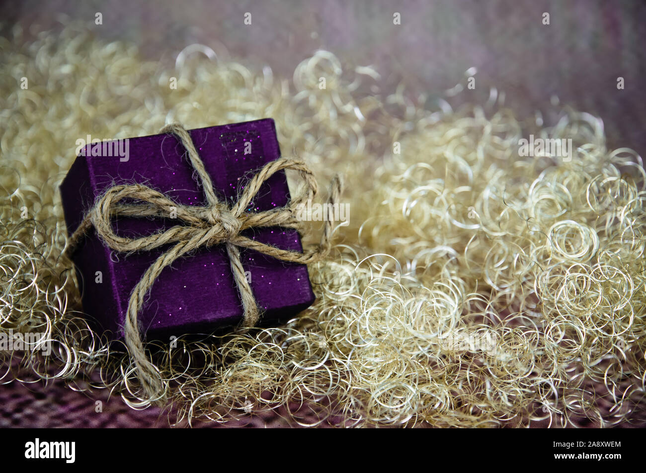 simple blue christmas box with surprise inside in golden background ...