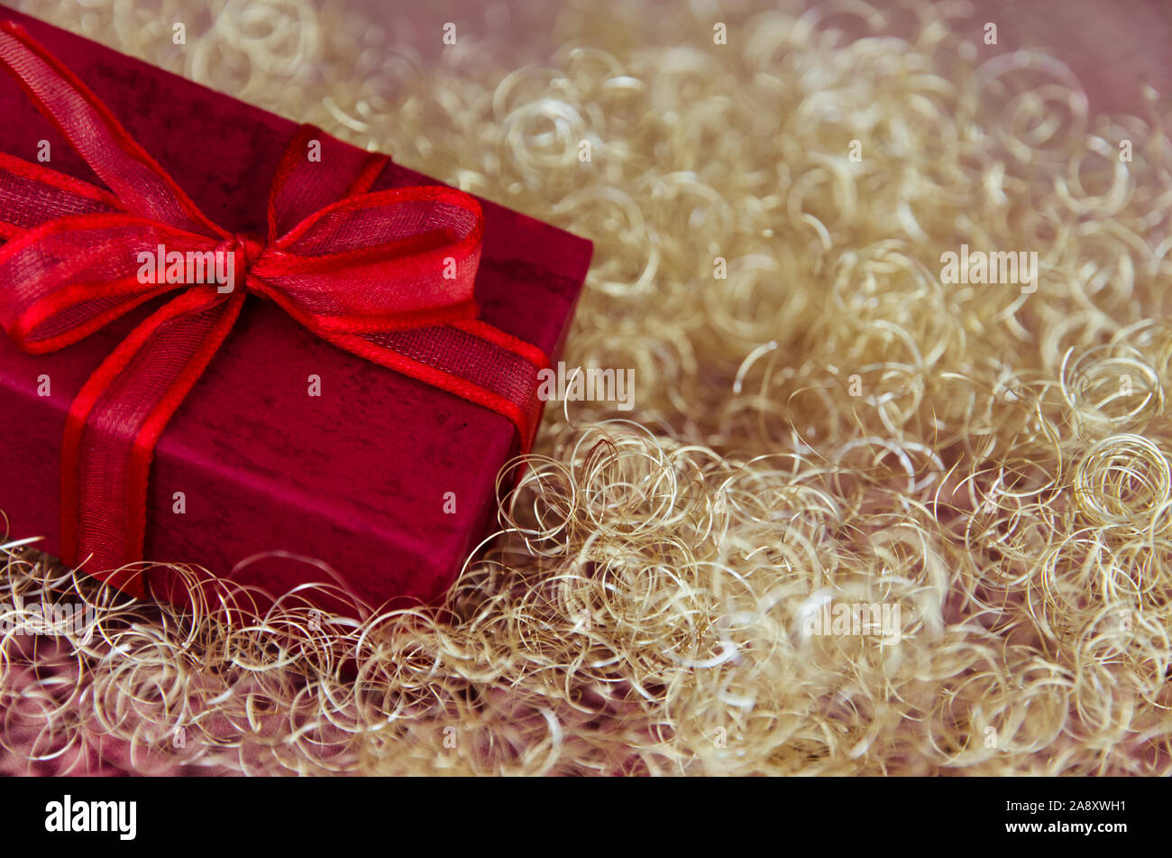 shining red christmas box with surprise inside in golden background ...