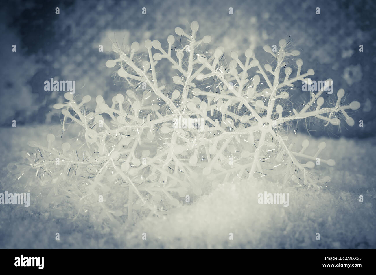 simple white snowflake decoration in snowy background Stock Photo - Alamy