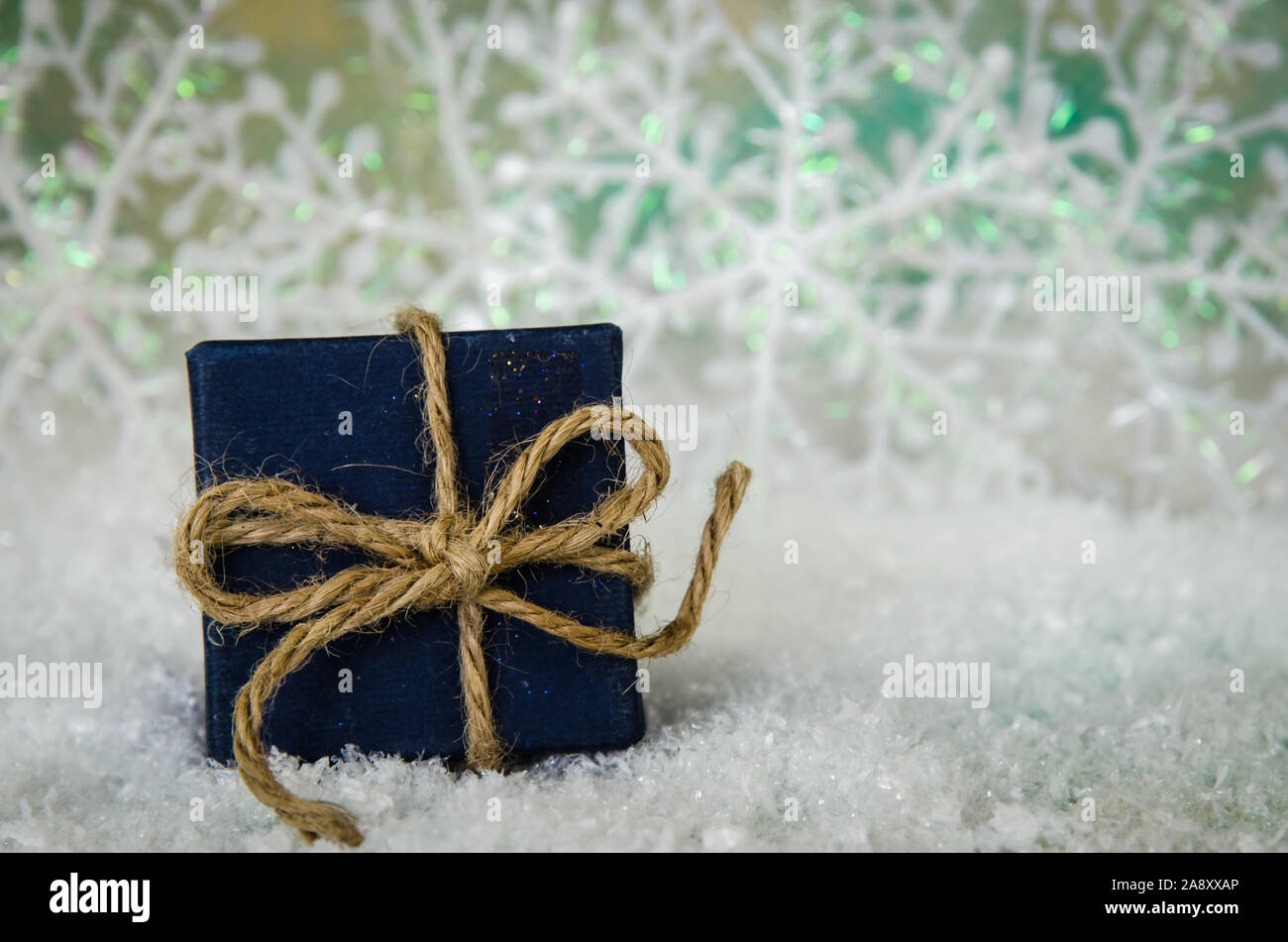 simple blue christmas box with surprise inside in golden background ...