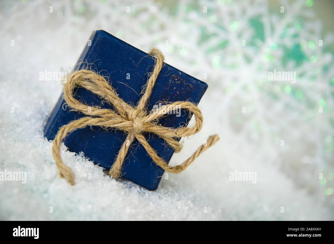 simple blue christmas box with surprise inside in golden background ...