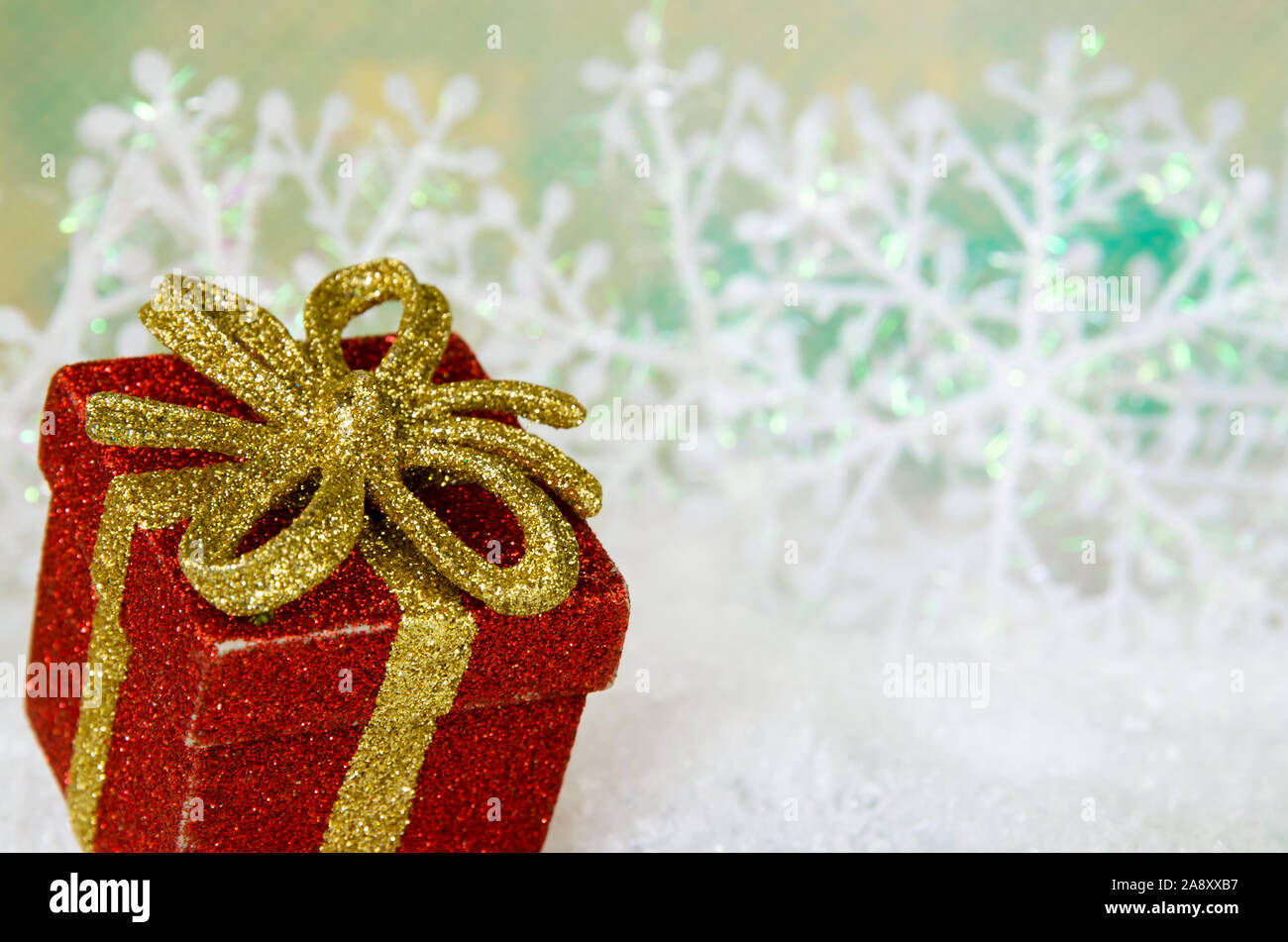 shining red christmas box with surprise inside in golden background ...