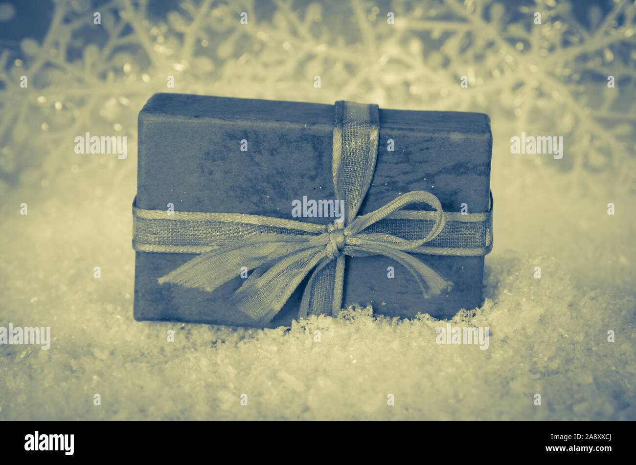 simple blue christmas box with surprise inside in golden background ...
