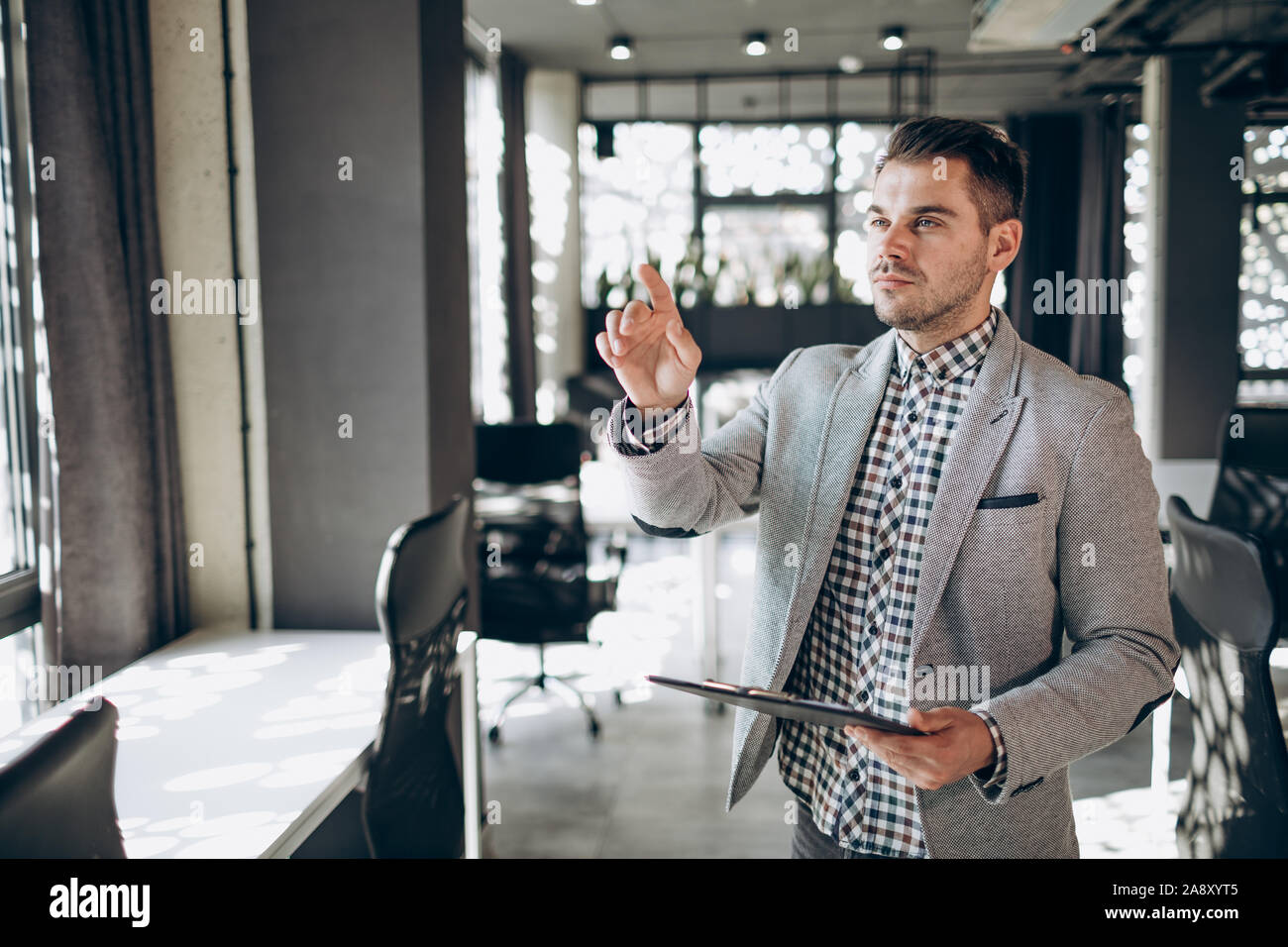 Young Office Employee is Pointing Out Important Issues Stock Photo - Alamy